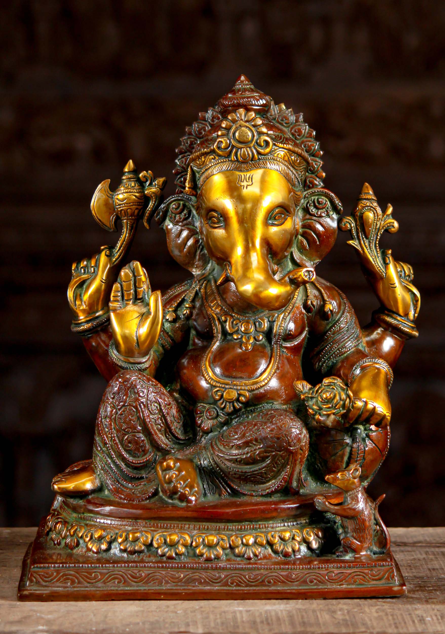 Brass Ganesh Statue Seated In Relaxed Posture Holding Lotus Flower With Om And Trident Tilak 14